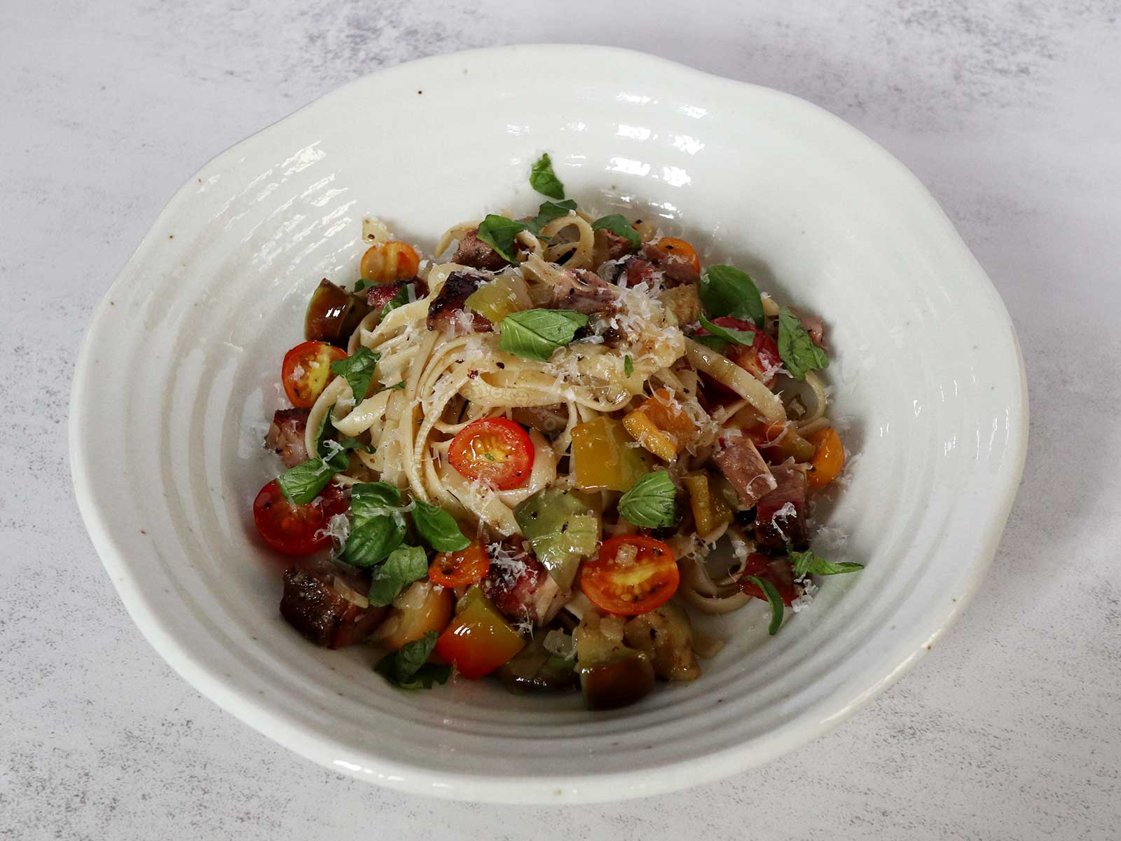 How to serve pasta: sauce over noodles or noodles in sauce?