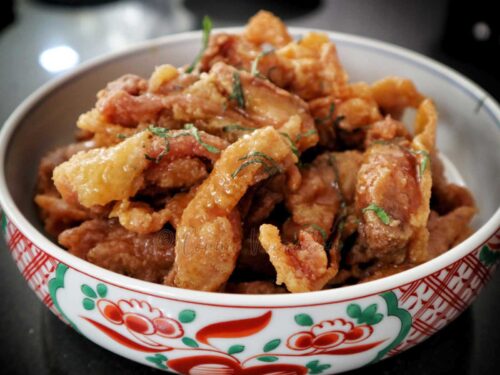 Crispy fried chicken fillets with lemon orange sauce